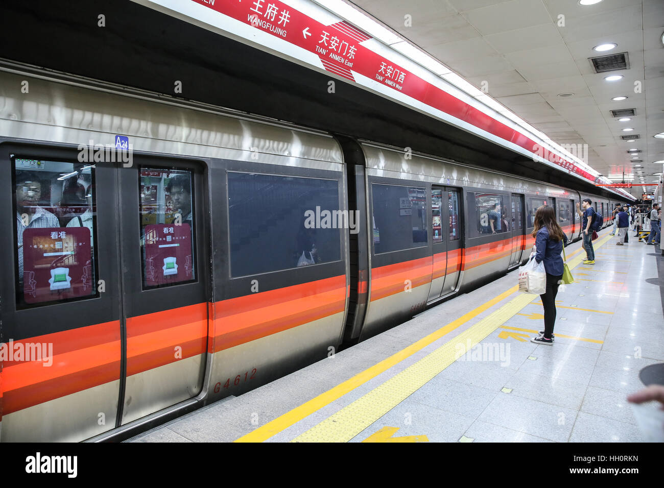 Chinese commuters packed into a subway train carriage during rush hour ...