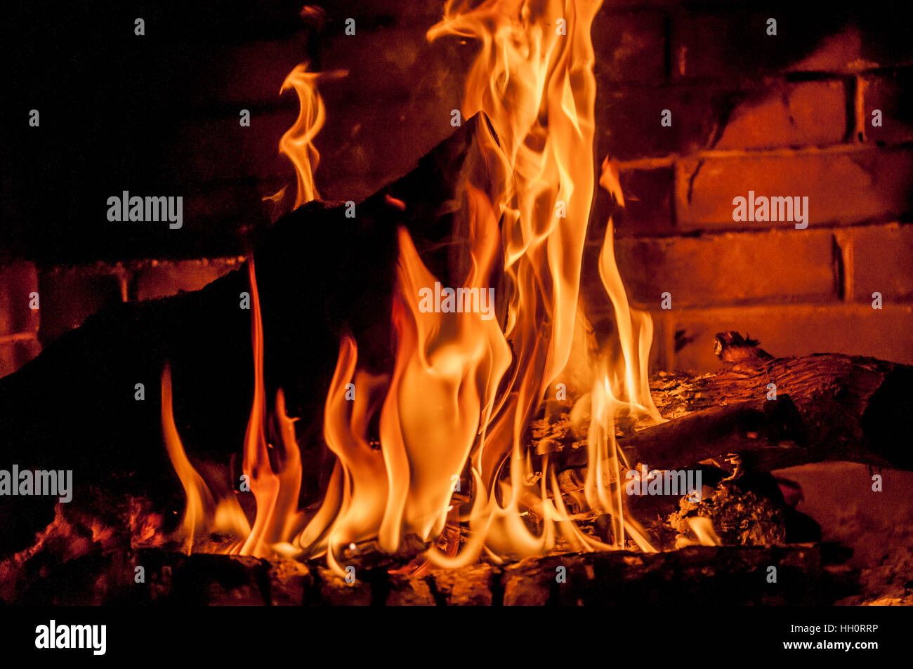 log is burning in fireplace Stock Photo - Alamy