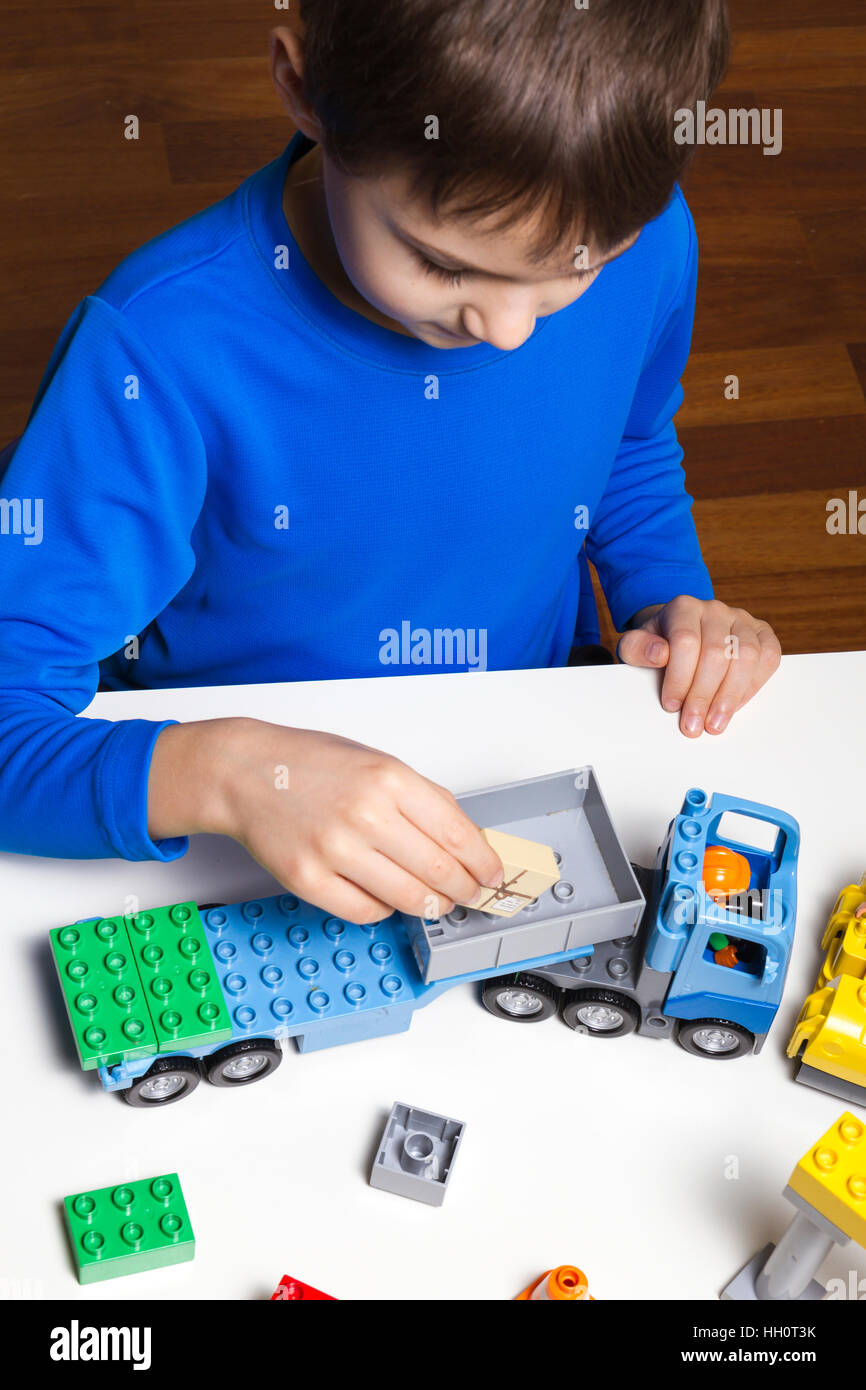 Vilnius, Lithuania - January 14, 2017: Little kid boy playing with Lego ...