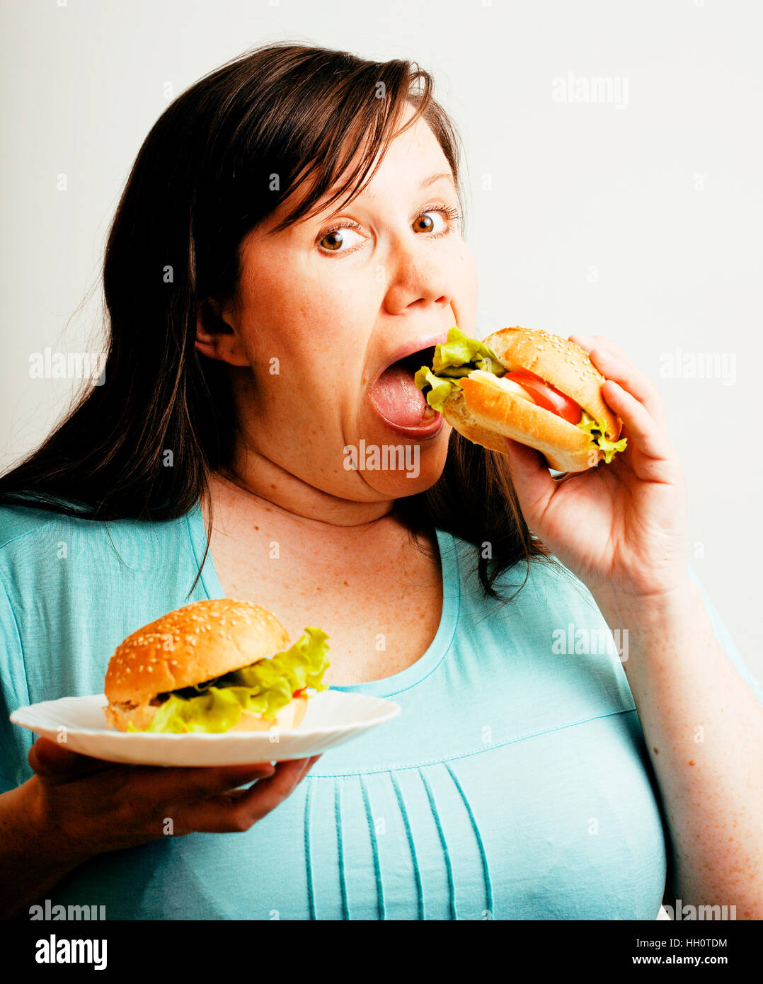 Woman having bun standing hi-res stock photography and images - Alamy