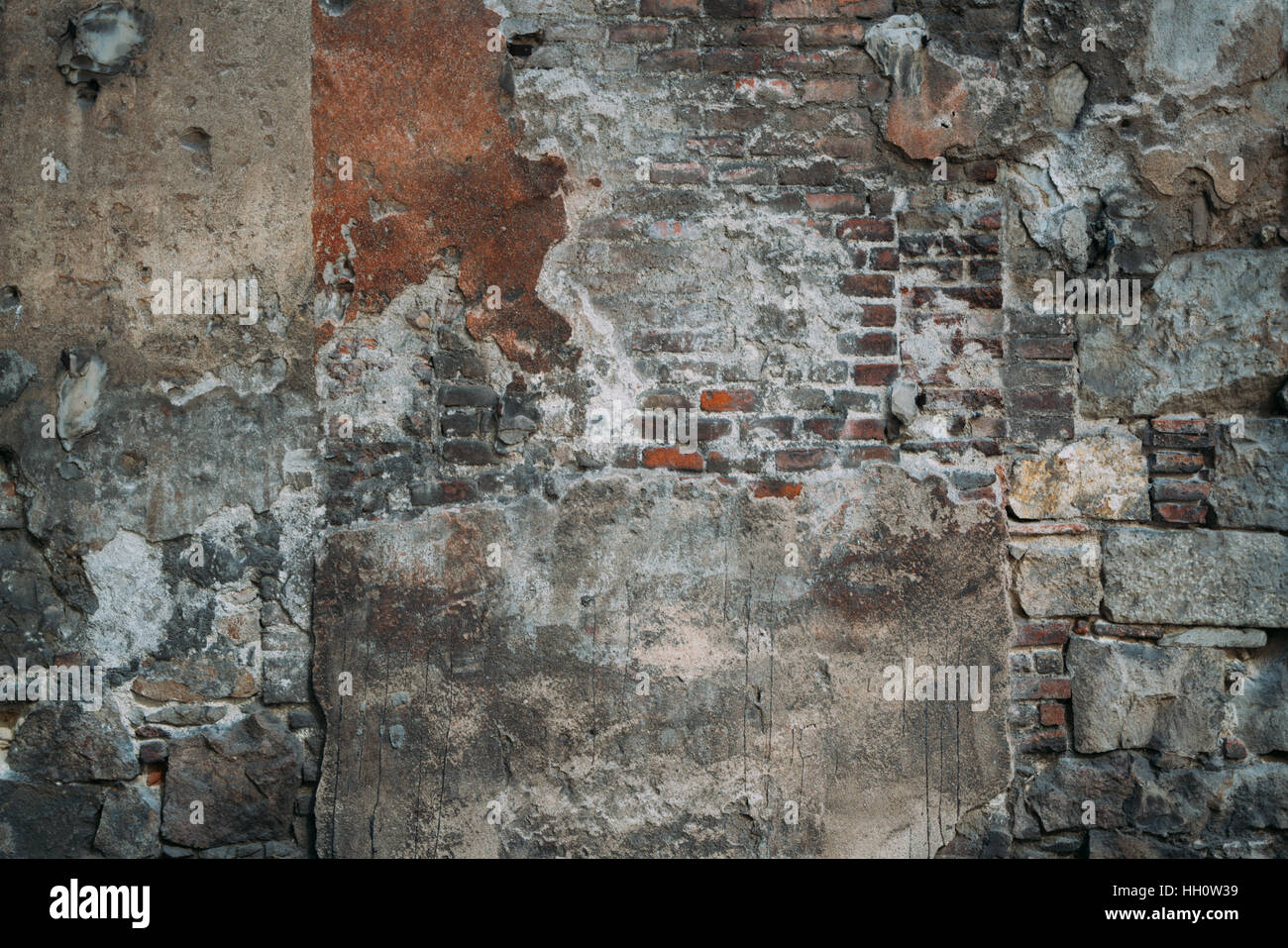 Mixed texture of stone, concrete, cement and bricks on the wall of old ...
