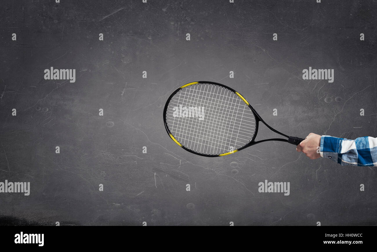 Close up on hand with big tennis racket Stock Photo - Alamy