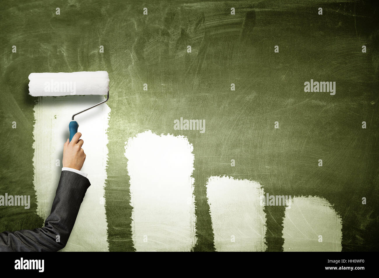 Hand of person painting wall with roller Stock Photo - Alamy