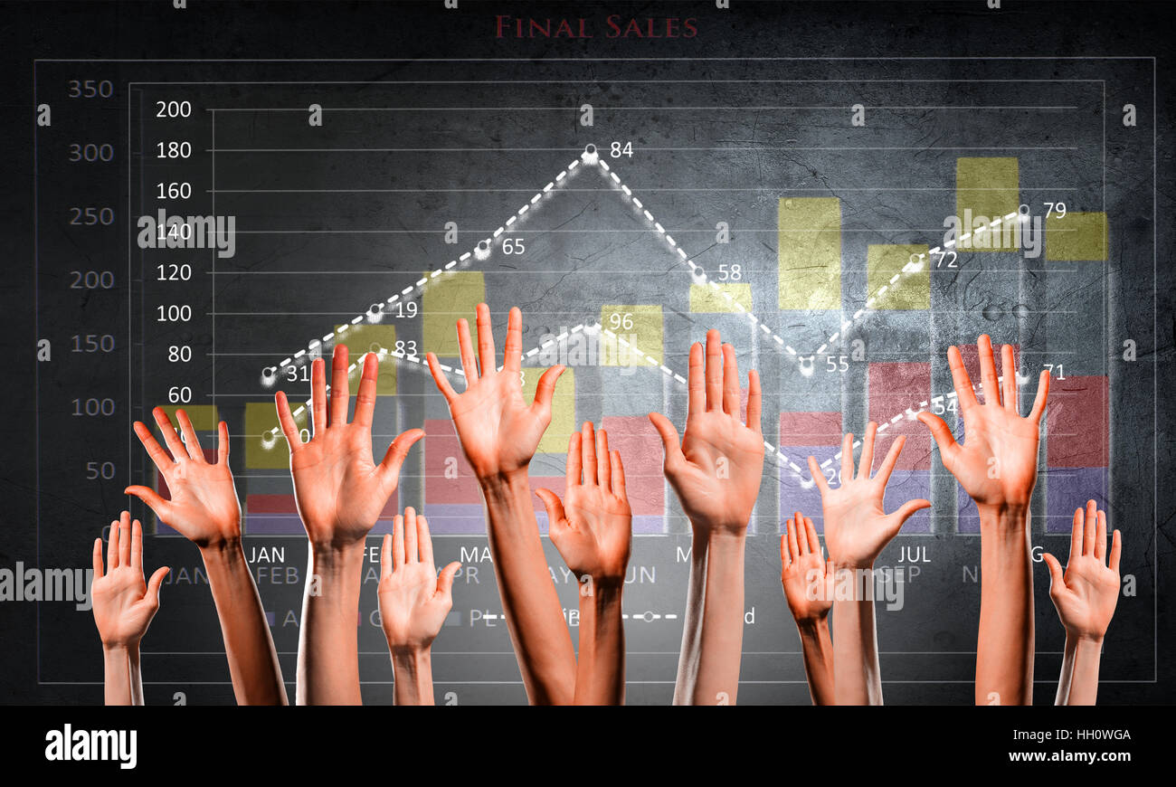 Row of raised hands showing different gestures and graphs at background ...