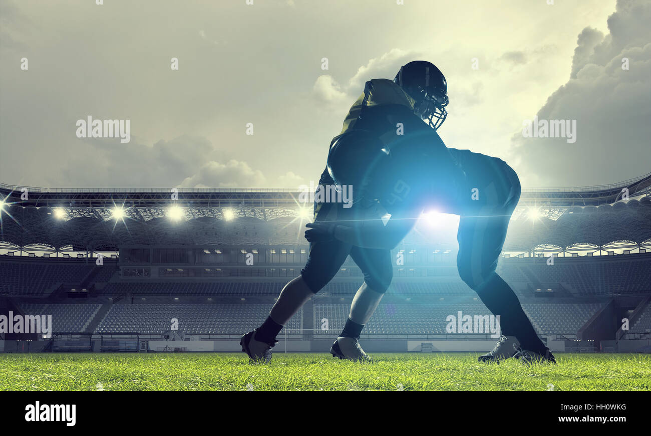 Two american football players fighting for ball. Mixed media Stock ...