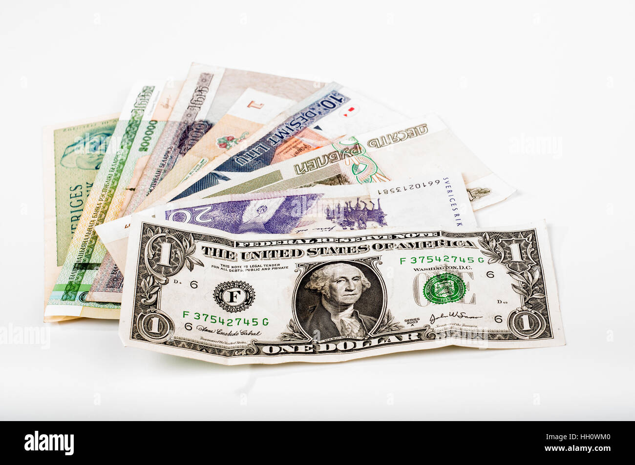 various currency paper bills on white background Stock Photo - Alamy