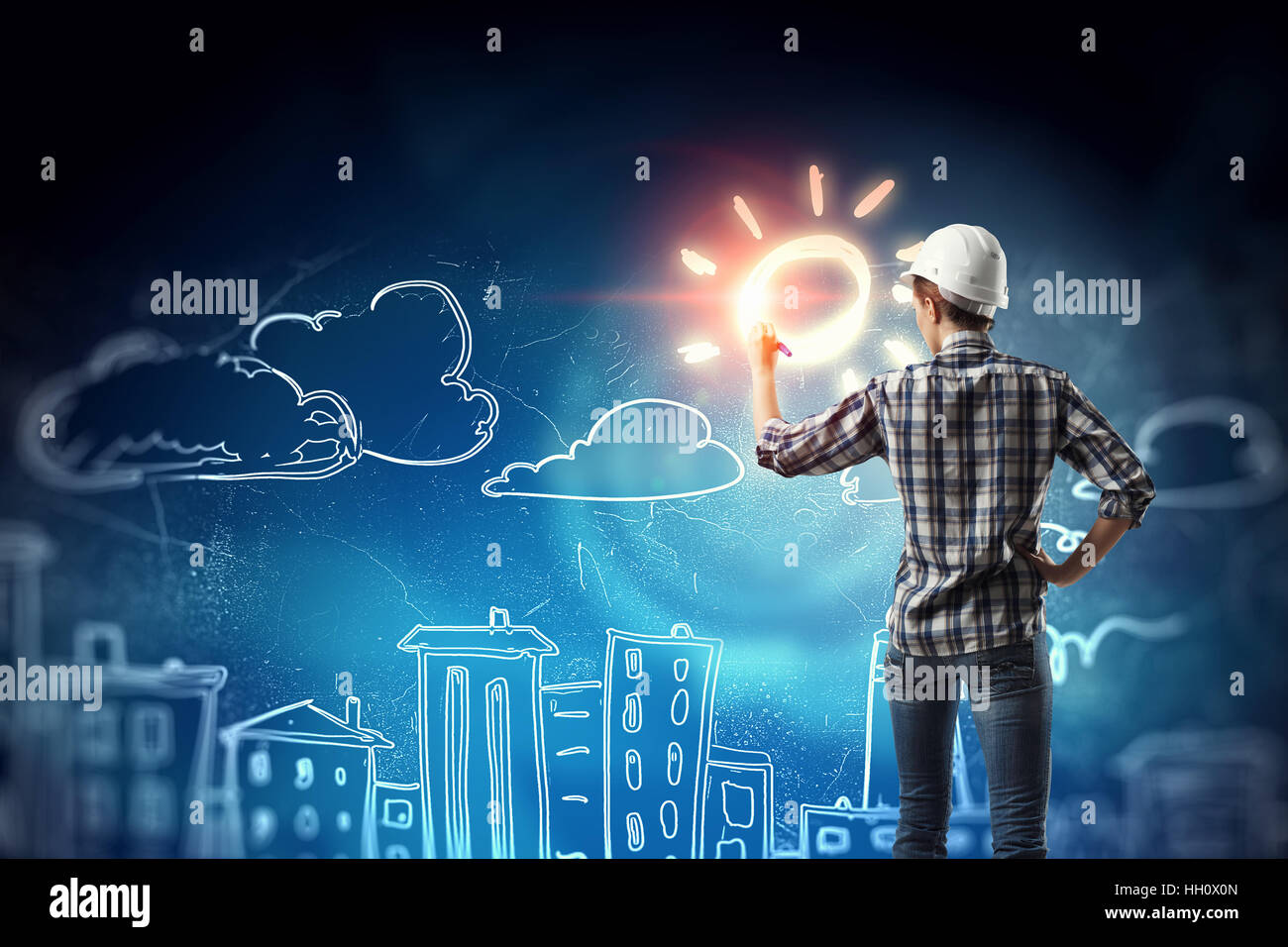 Rear view of engineer woman drawing construction plan Stock Photo - Alamy