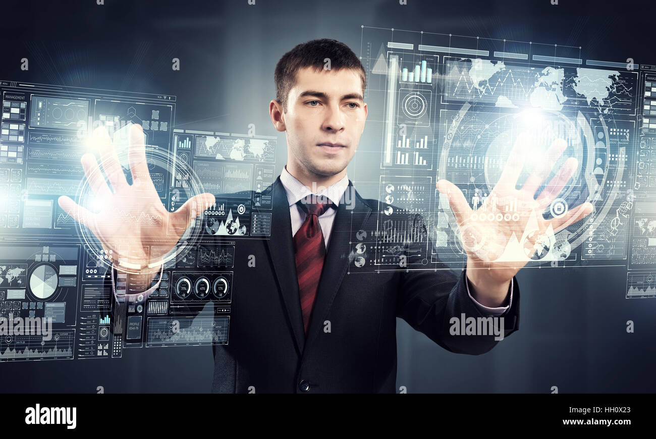 Young handsome businessman working with virtual interface panel . Mixed ...