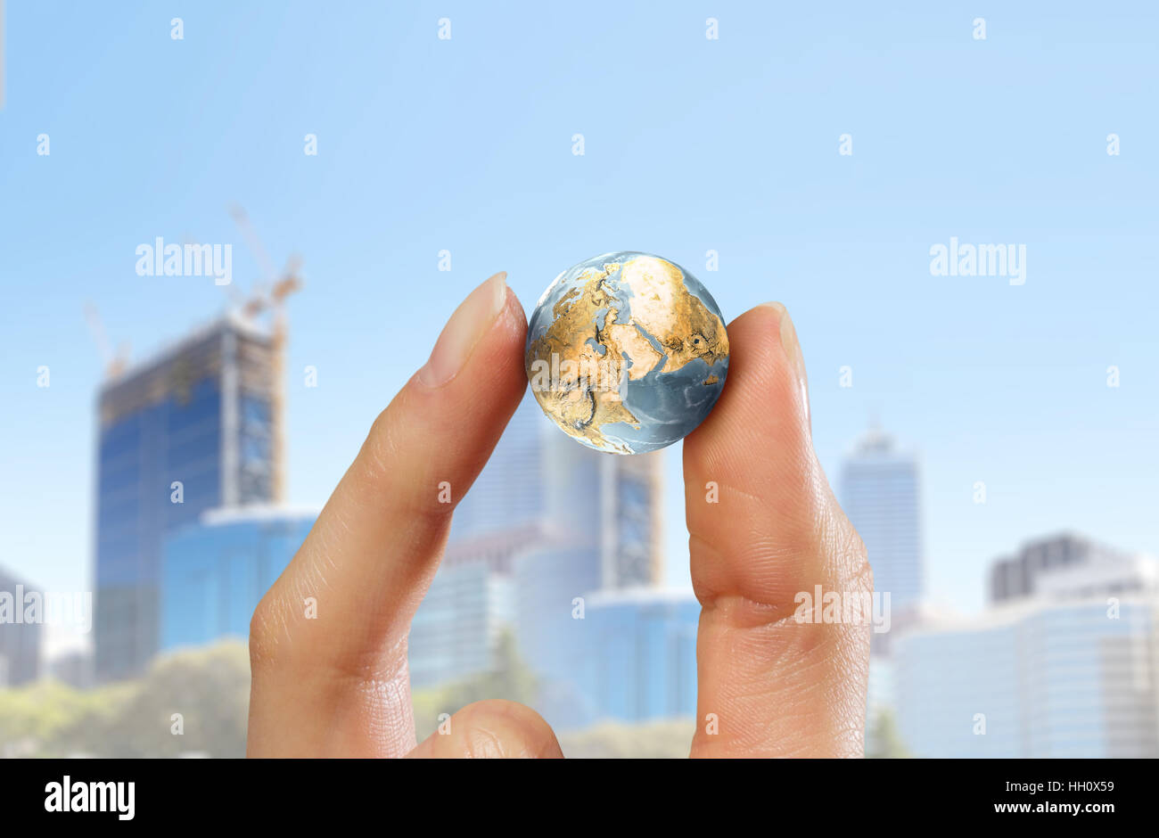 Small Earth planet ball between female fingers. Elements of this image ...