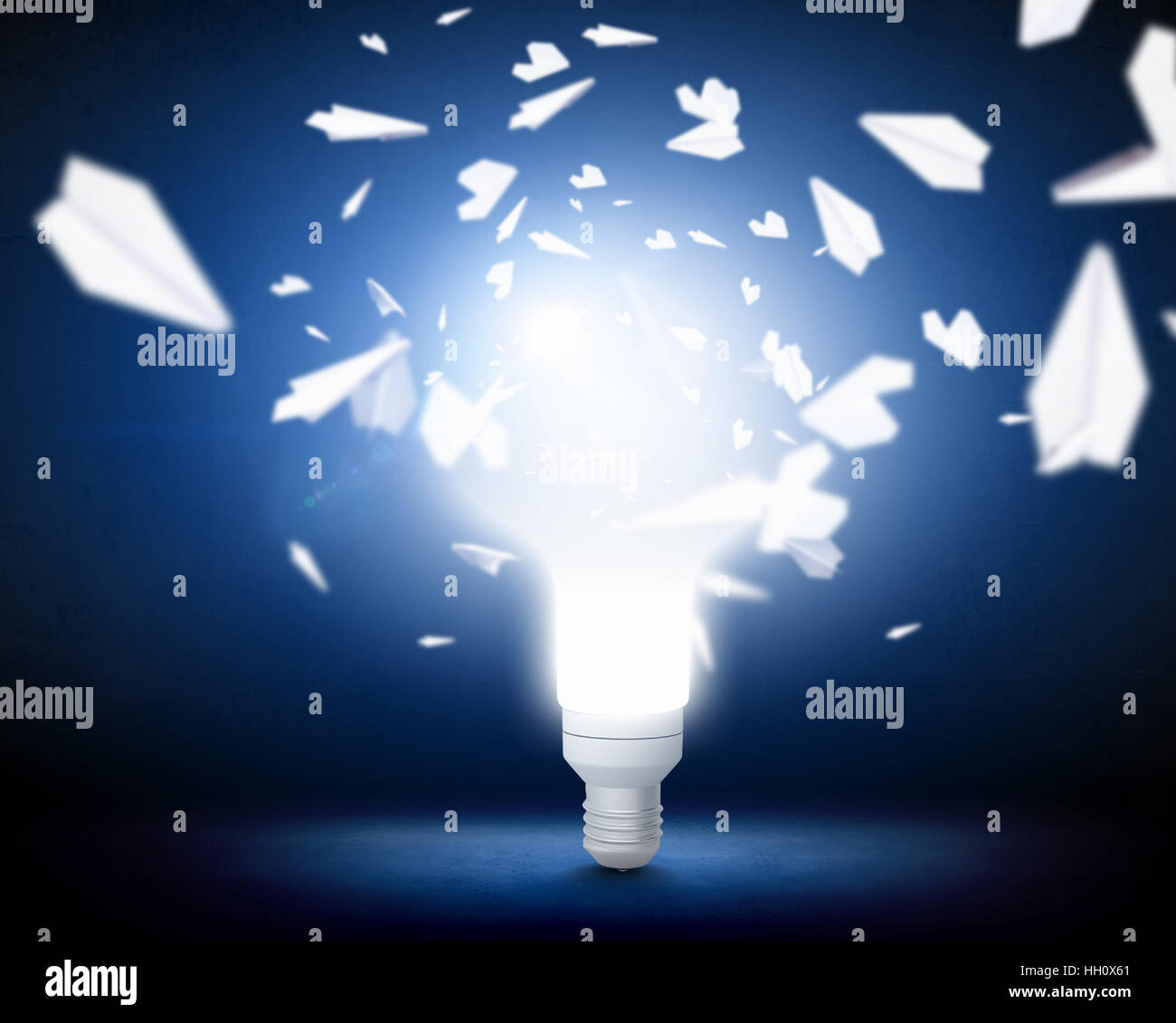 Glowing light bulb and paper planes flying around Stock Photo - Alamy