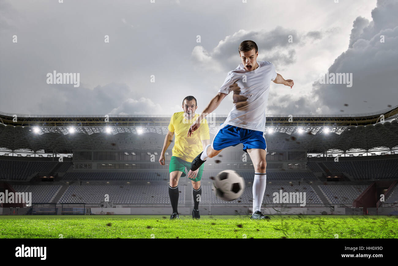 Soccer players in action on stadium fighting for ball. Mixed media ...