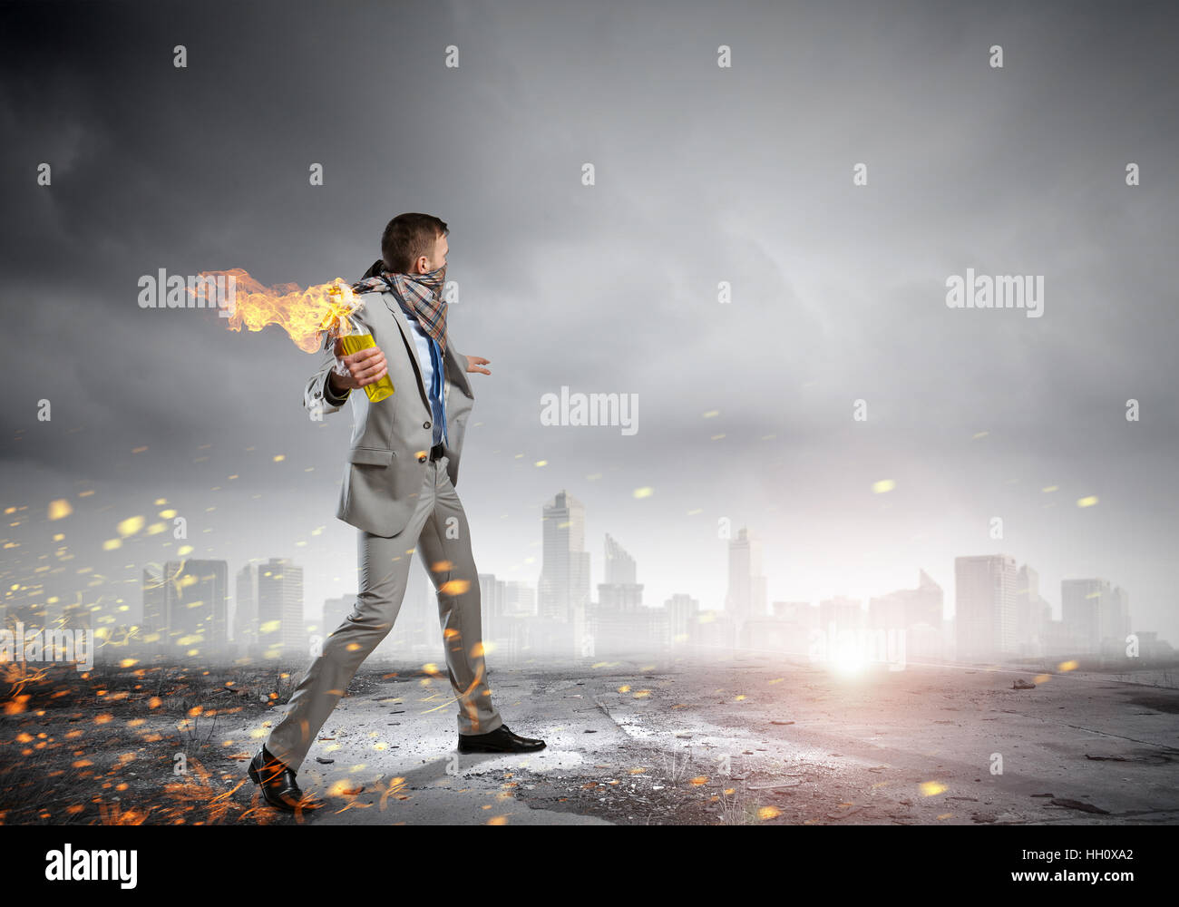 Young aggressive businessman throw burning molotov cocktail Stock Photo ...