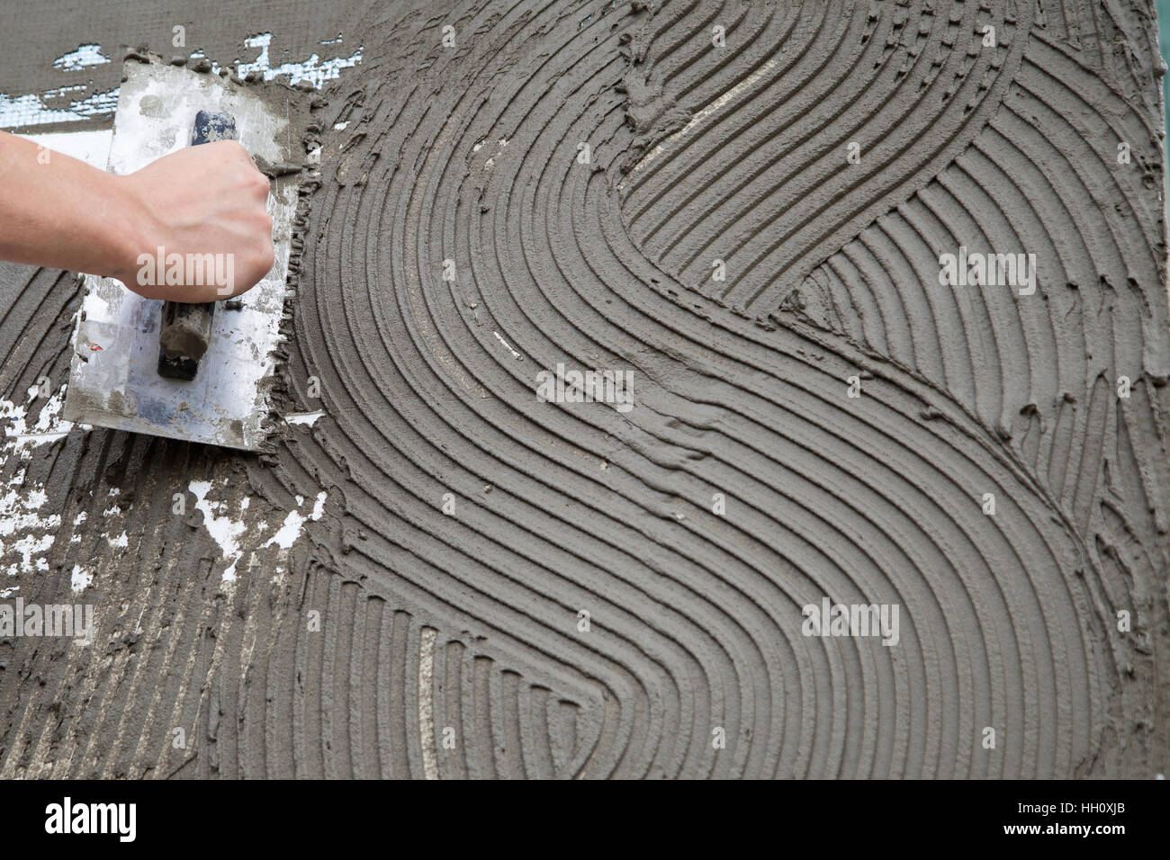 Plastering the wall Stock Photo - Alamy