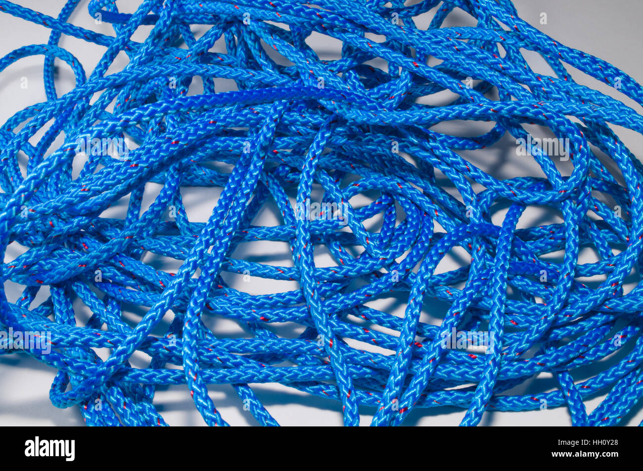 New modern braided blue rope bundle tangled coil Stock Photo - Alamy