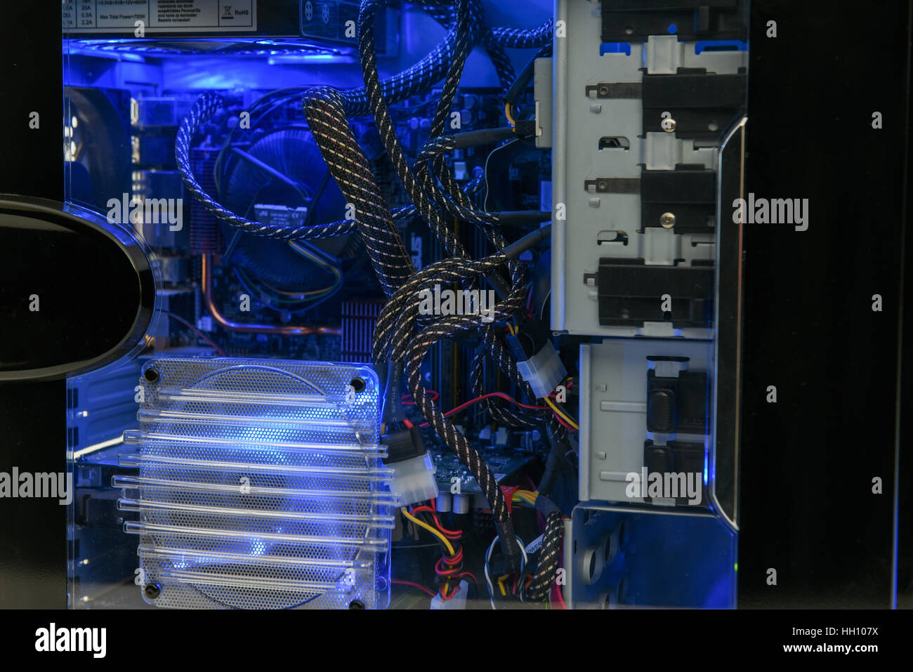 Illuminated computer hardware with a look inside the box Stock Photo ...