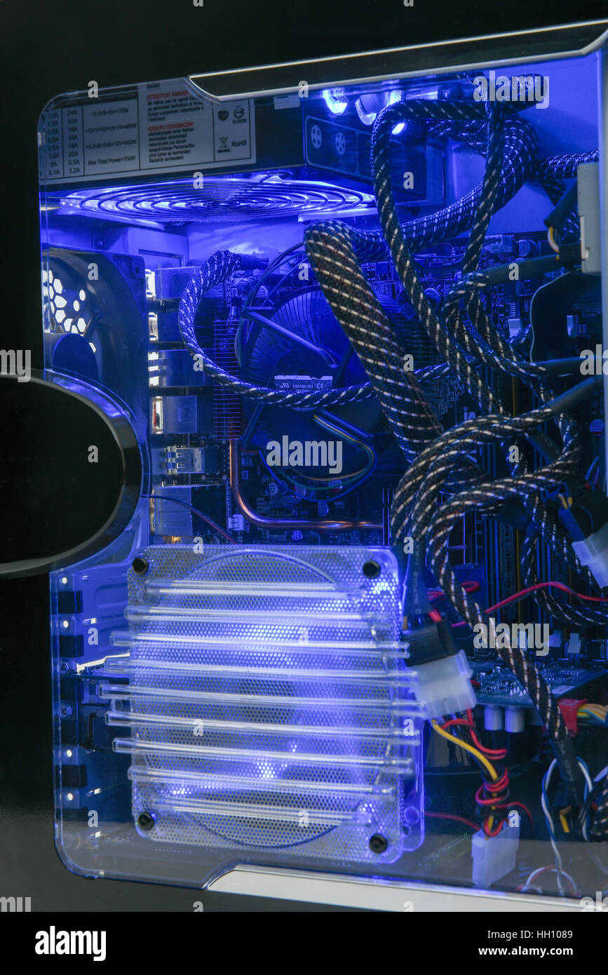 Illuminated computer hardware with a look inside the box Stock Photo ...