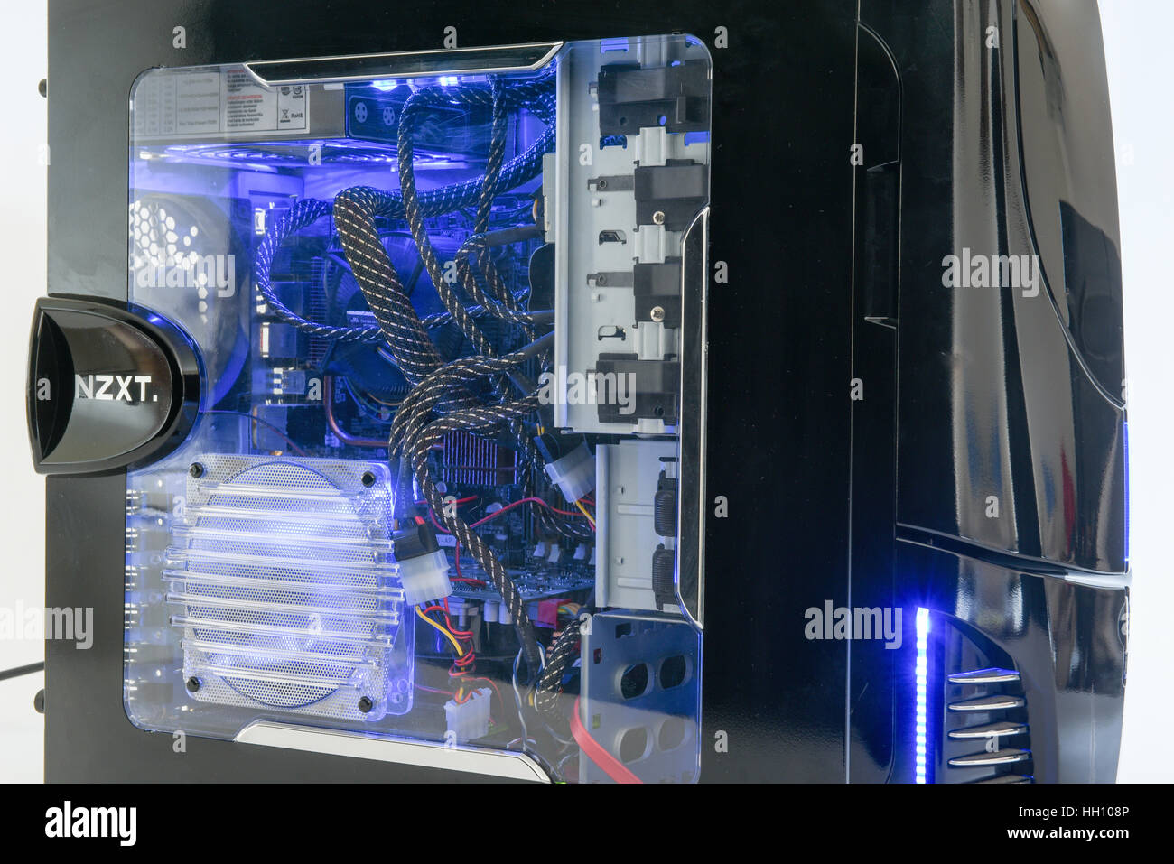 Illuminated computer hardware with a look inside the box Stock Photo ...