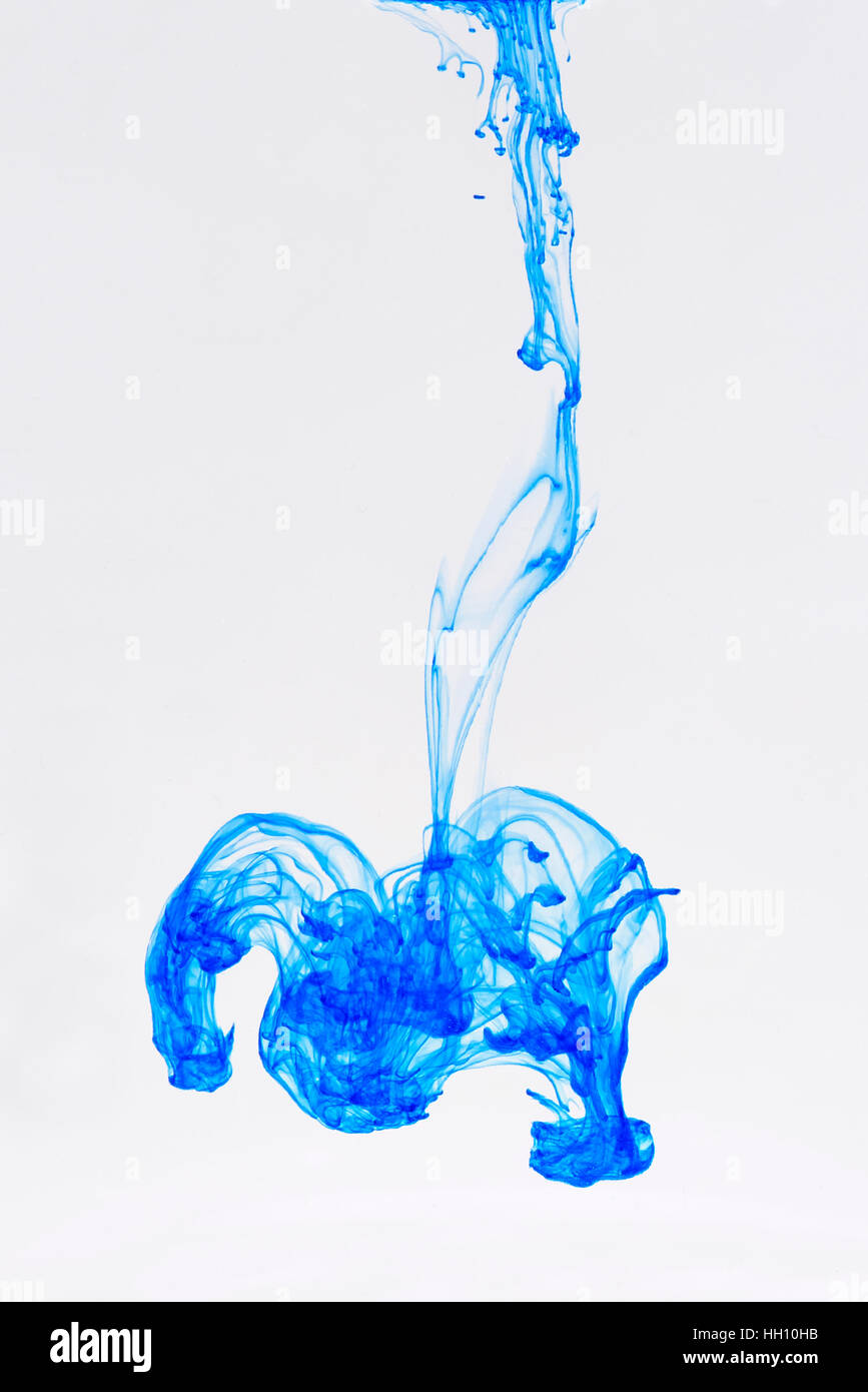 Abstract transition blue color ink Dropped Into Water Stock Photo - Alamy