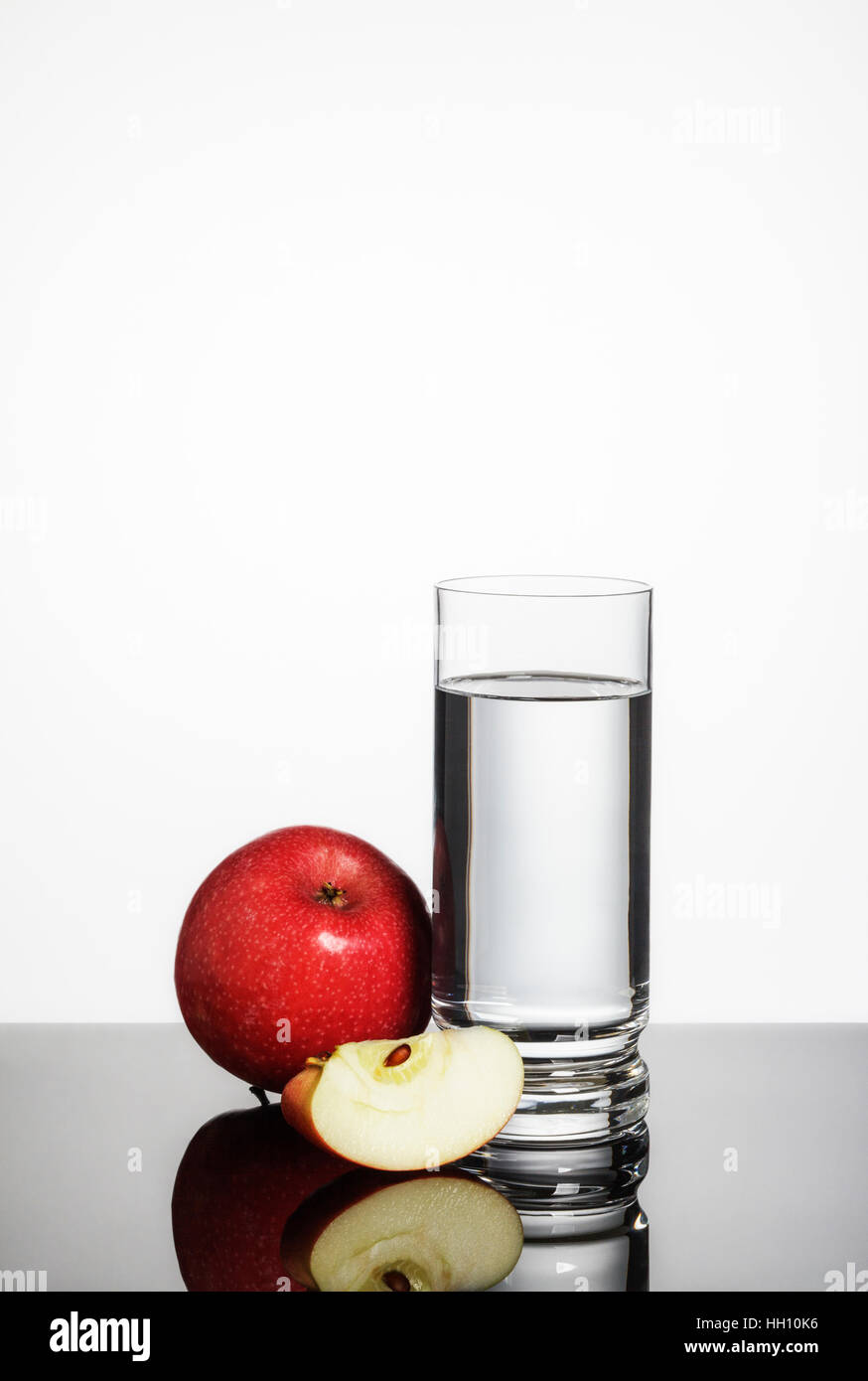 One Apple and a Glass of Water Stock Photo - Alamy