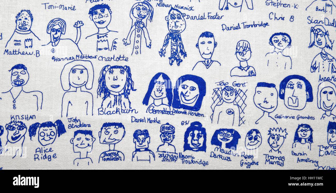 A school tea towel with with self portraits drawn by pupils Stock Photo ...