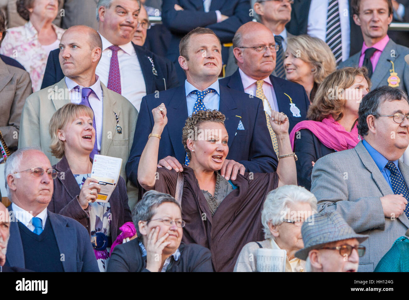 Spectators at Goodwood cheering on a horse race Stock Photo - Alamy
