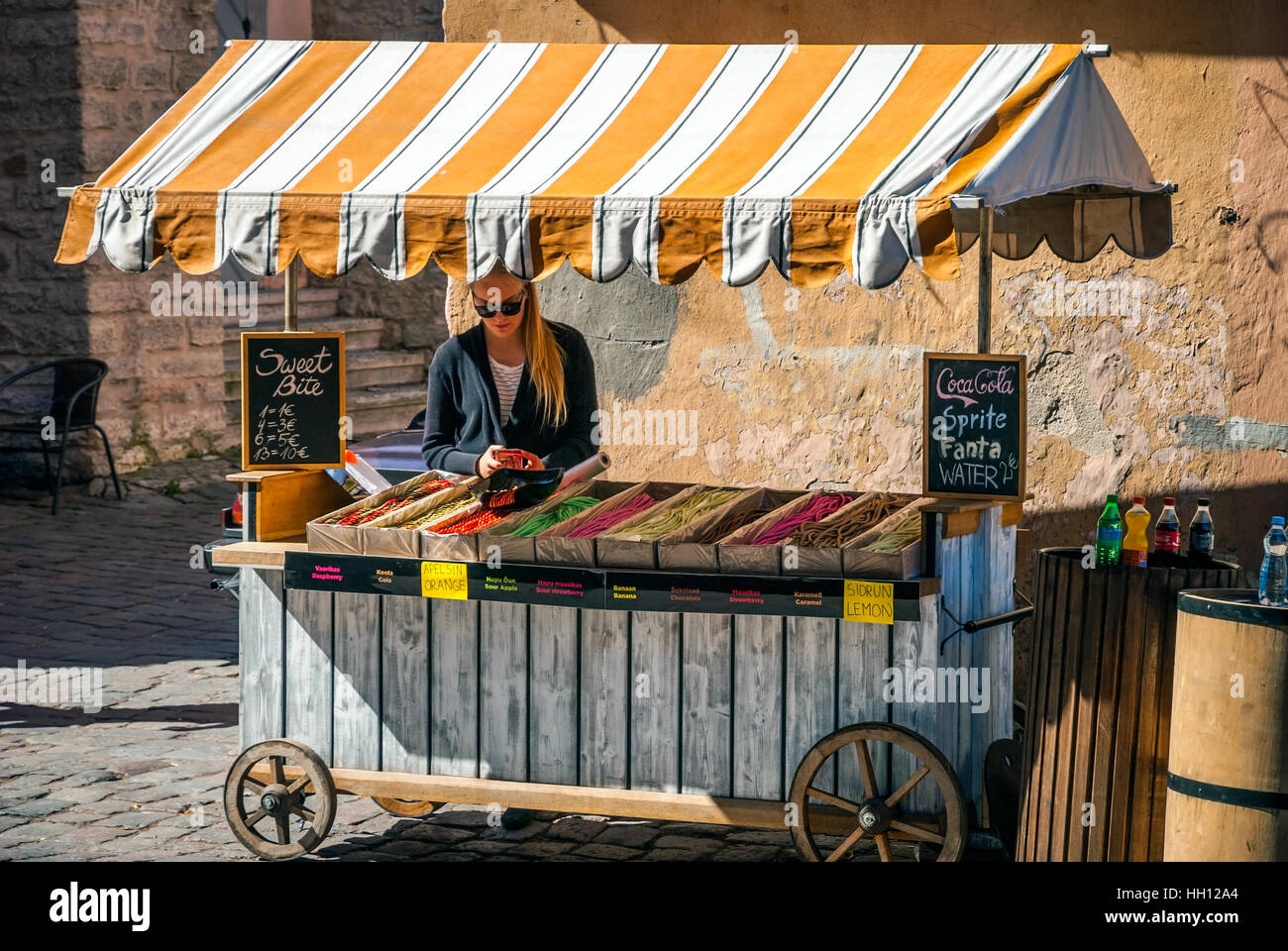 TALLINN, ESTONIA - AUGUST 15: Woman selling local candies on street ...