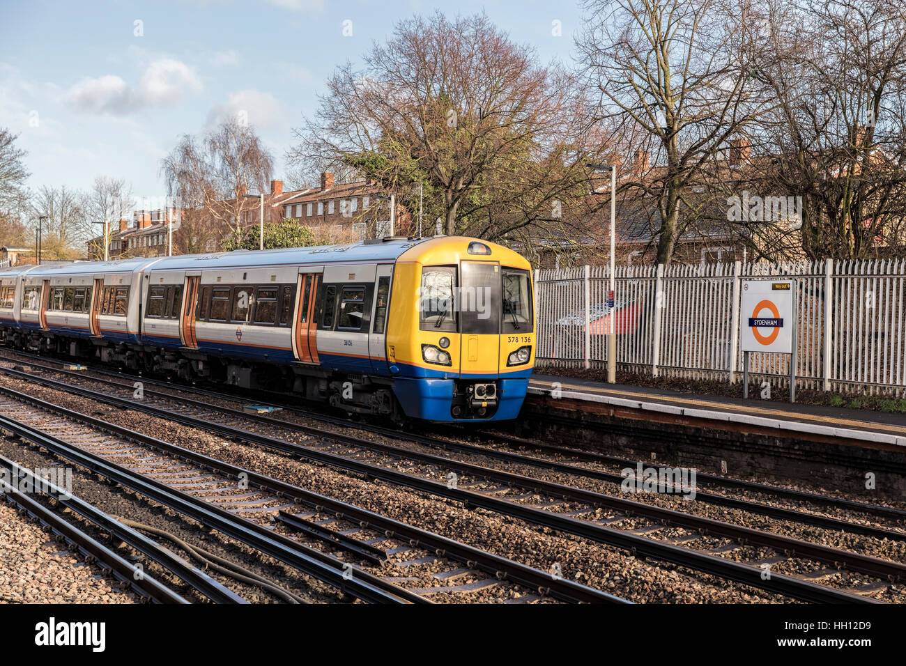 Overground train pulls into the platform at Sydenham station in south ...
