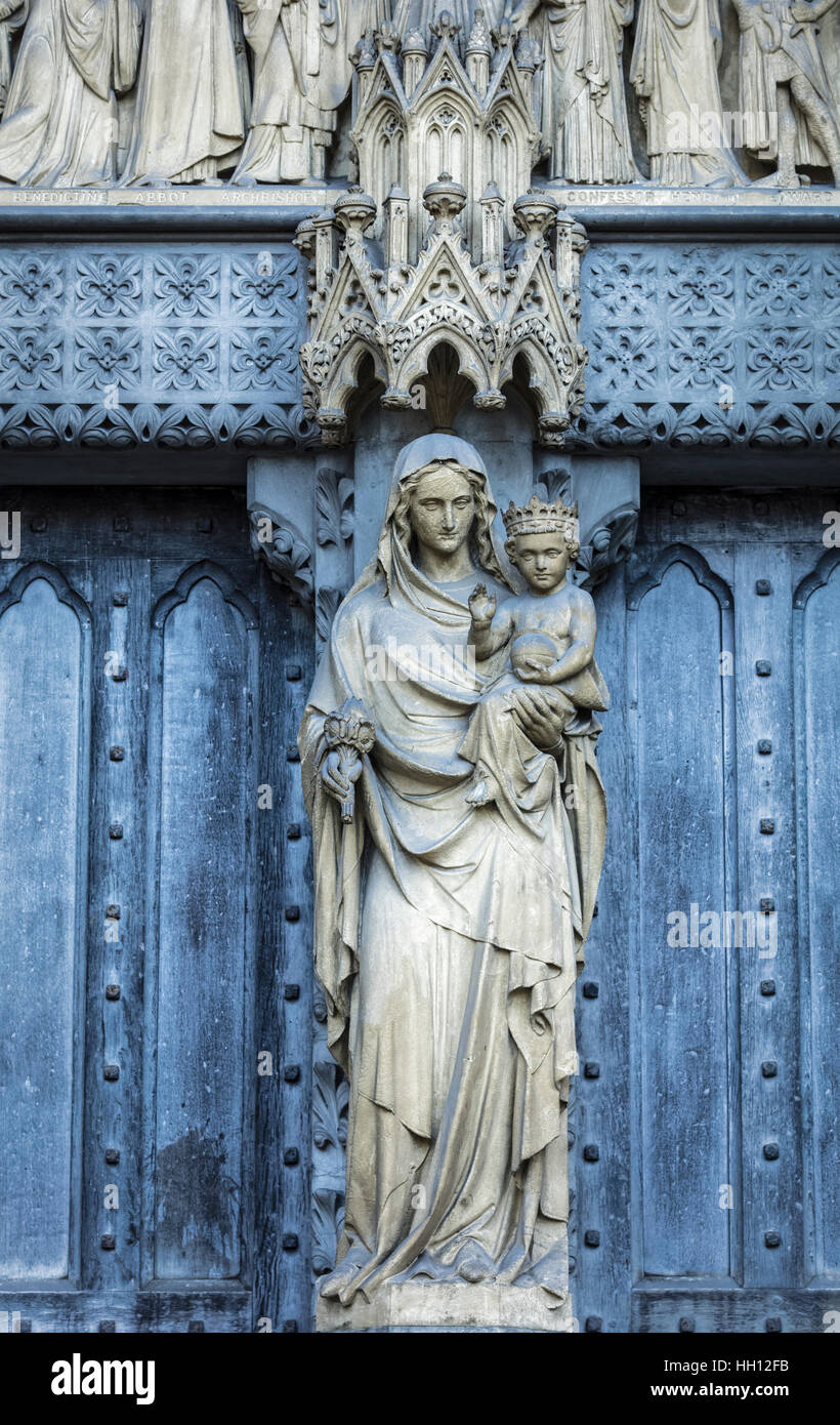 Statue of the Virgin Mary with Jesus Christ as a baby at the main door ...