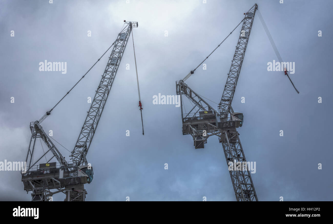 Two tower cranes with a sky background in London England Stock Photo ...