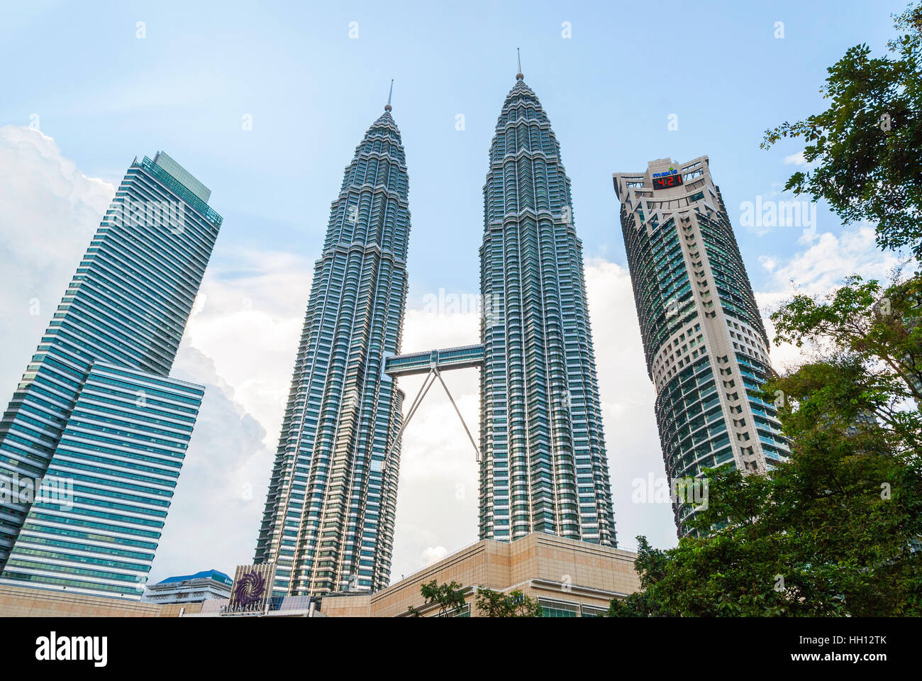 View on famous high-rise Petronas twin tower with bridge, Kuala Lumpur ...