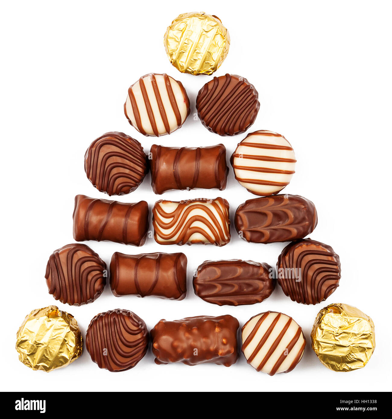 Triangle made of chocolate candies isolated on white background Stock ...