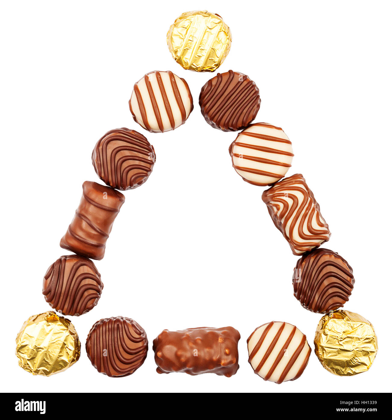 Triangle made of chocolate candies isolated on white background Stock ...