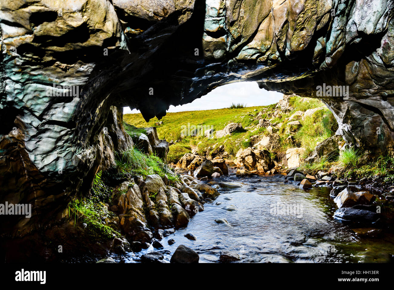 Looking out from a cave at Ribblehead in the Yorkshire Dales National ...