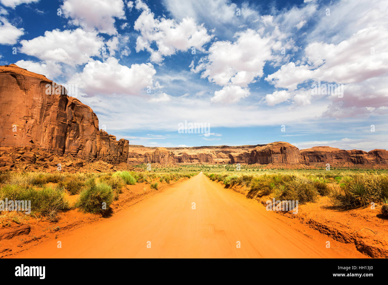 Sand road along red sandstones at Monument Valley Stock Photo - Alamy