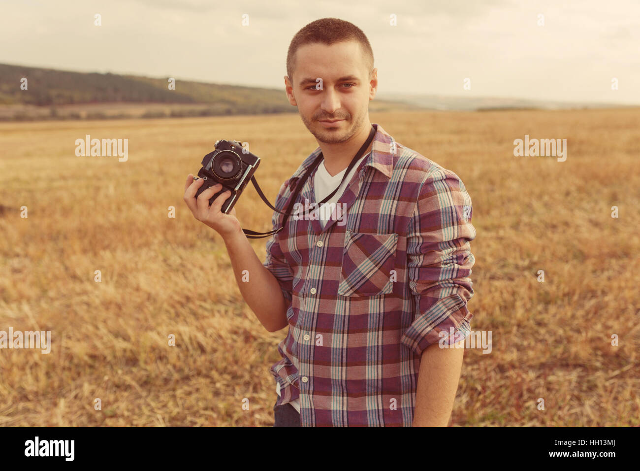 Attractive male photographer outdoors at sunset Stock Photo - Alamy