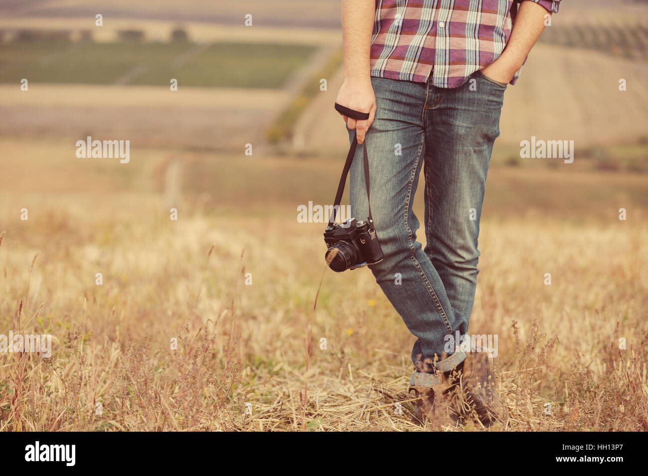Attractive male photographer outdoors at sunset Stock Photo - Alamy