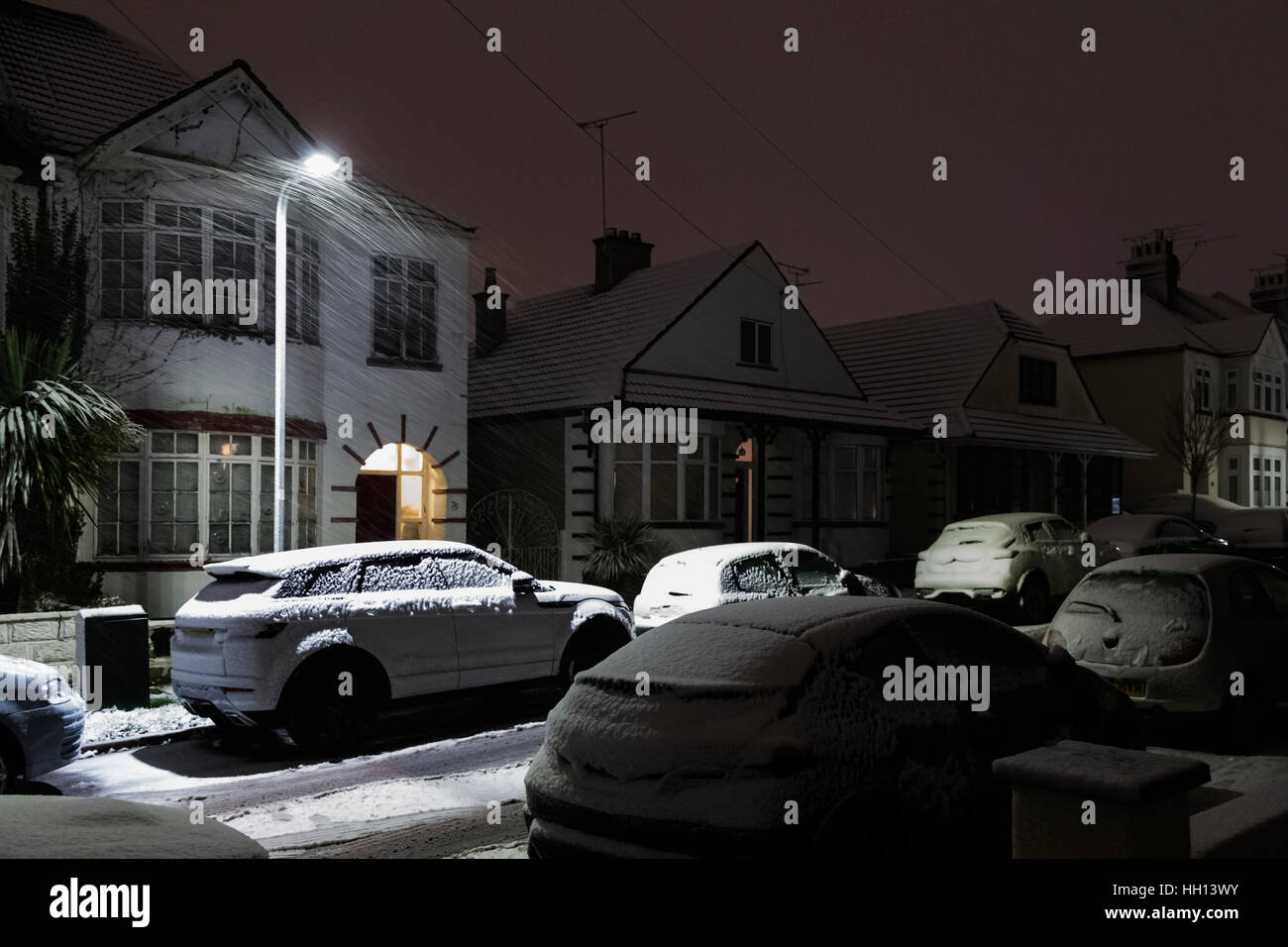 Snow Falling at Night on a Suburban Street Stock Photo - Alamy