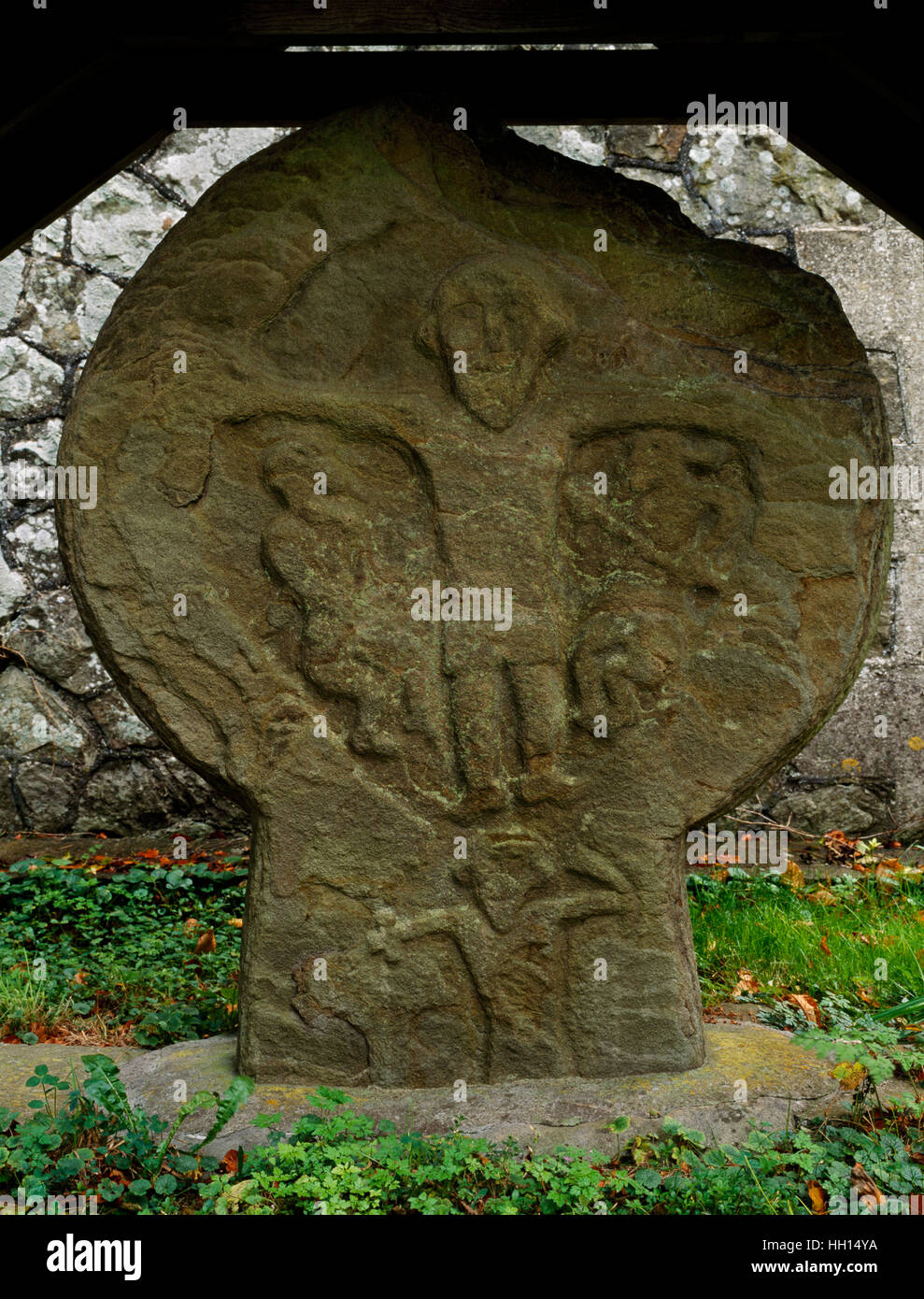 C9th disc-headed cross-slab, Llangan church: crucified Christ flanked ...