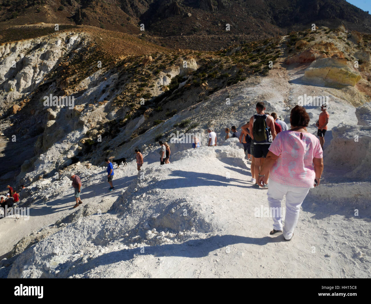 A tourist party walking down into the caldera of Stefanos Crater, Lakki ...