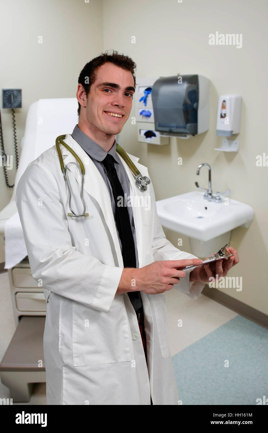 Man doctor holding a clipboard with a patient medical record chart ...