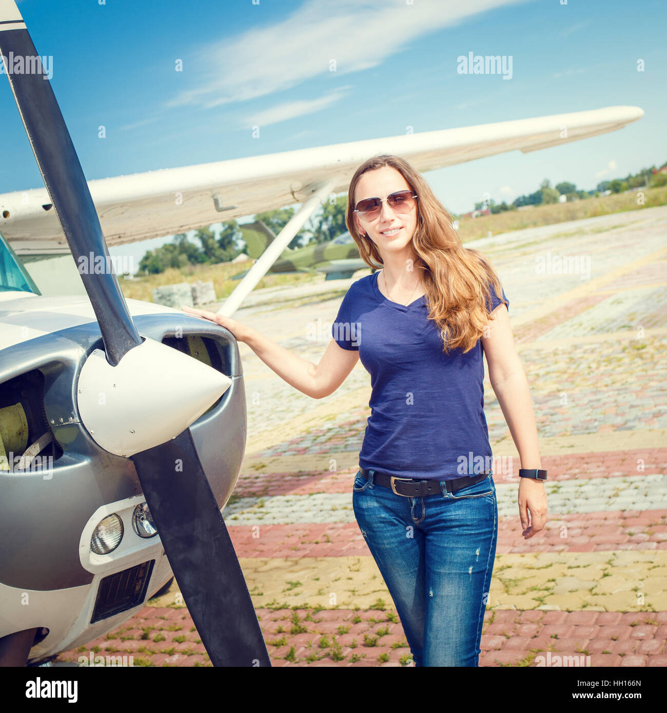 Attractive young female airline pilot hi-res stock photography and ...