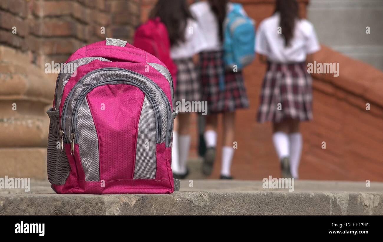 Backpack And Female Students Walking Stock Photo - Alamy