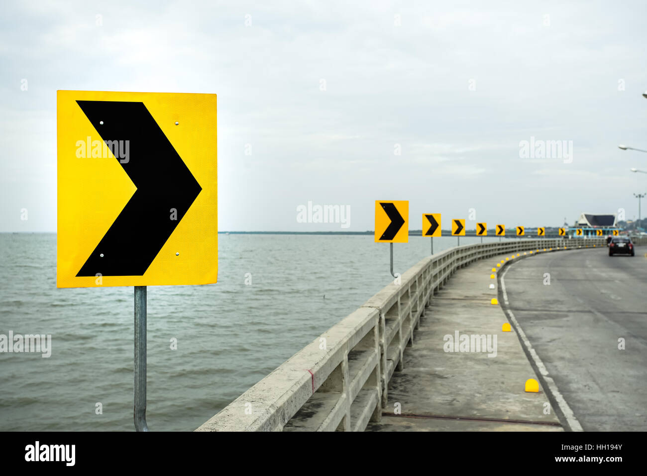 Curve road sign, signal turn right on the curve bridge Stock Photo - Alamy
