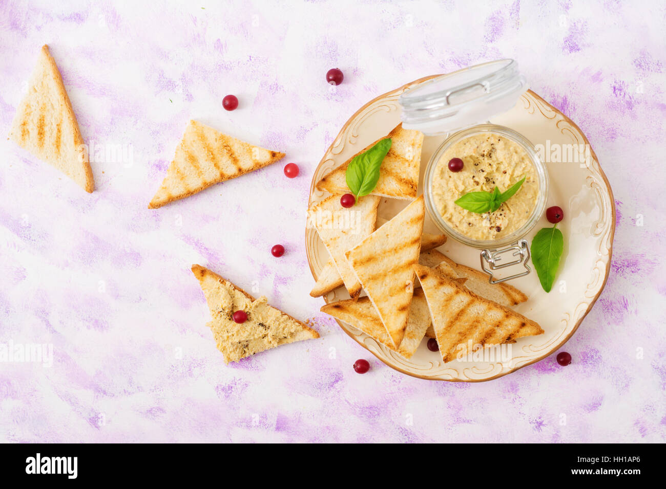 Pate Chicken - rillette, toast and herbs on a plate. Flat lay. Top view ...