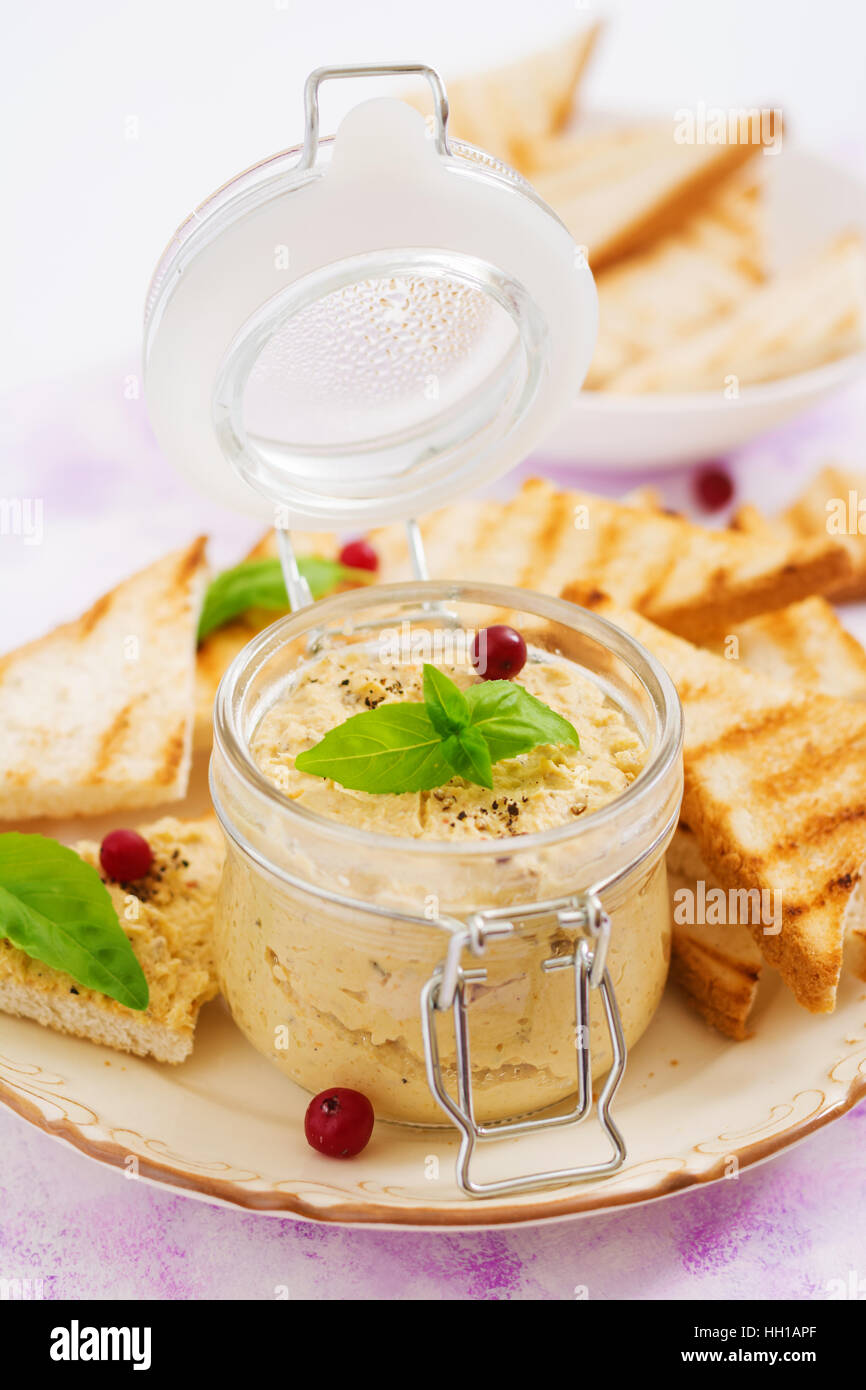 Pate Chicken - rillette, toast and herbs on a plate Stock Photo - Alamy