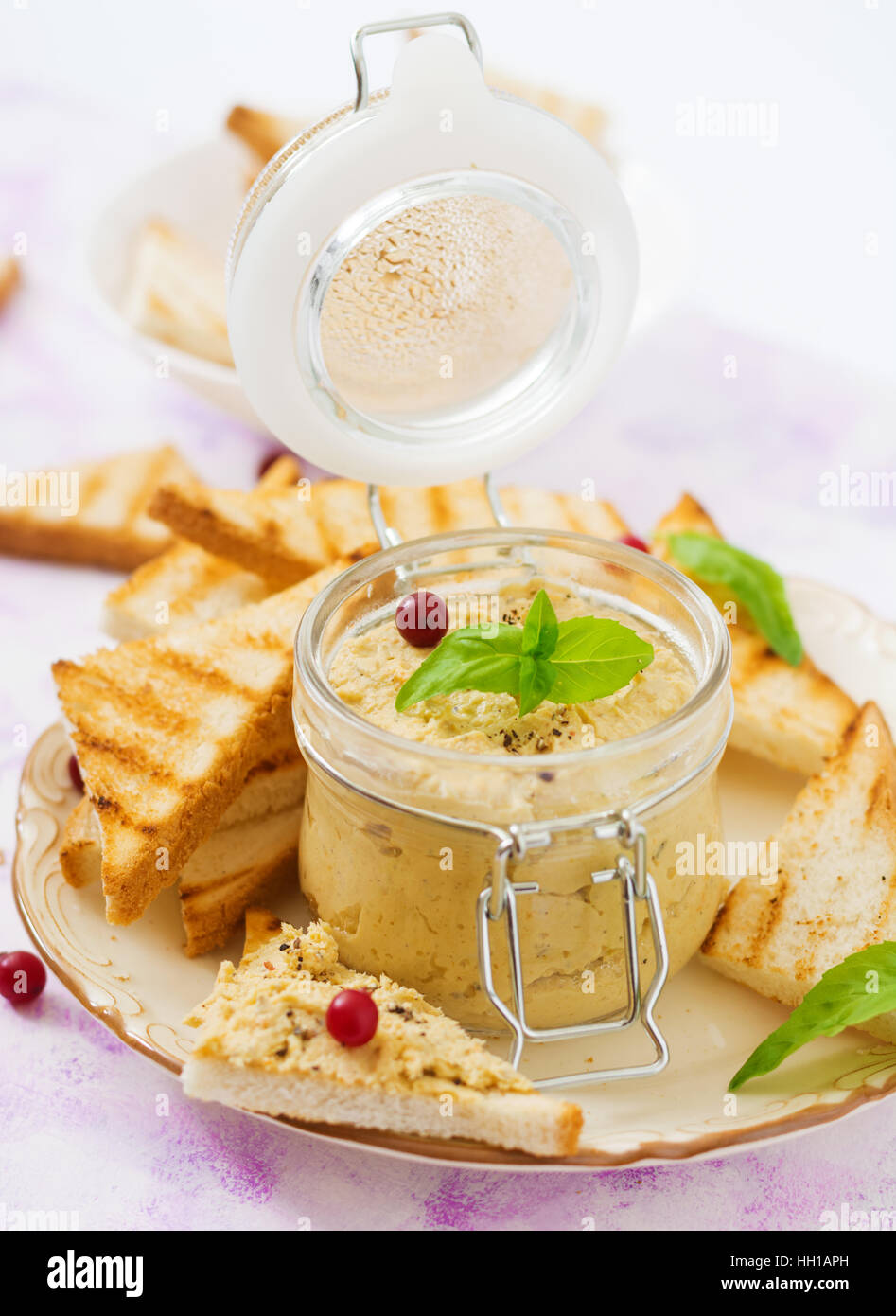 Pate Chicken - rillette, toast and herbs on a plate Stock Photo - Alamy