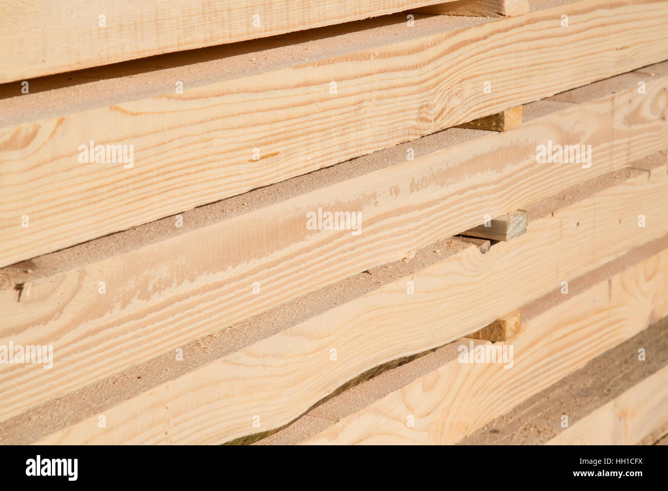 Stack of new wooden studs at the lumber yard Stock Photo - Alamy