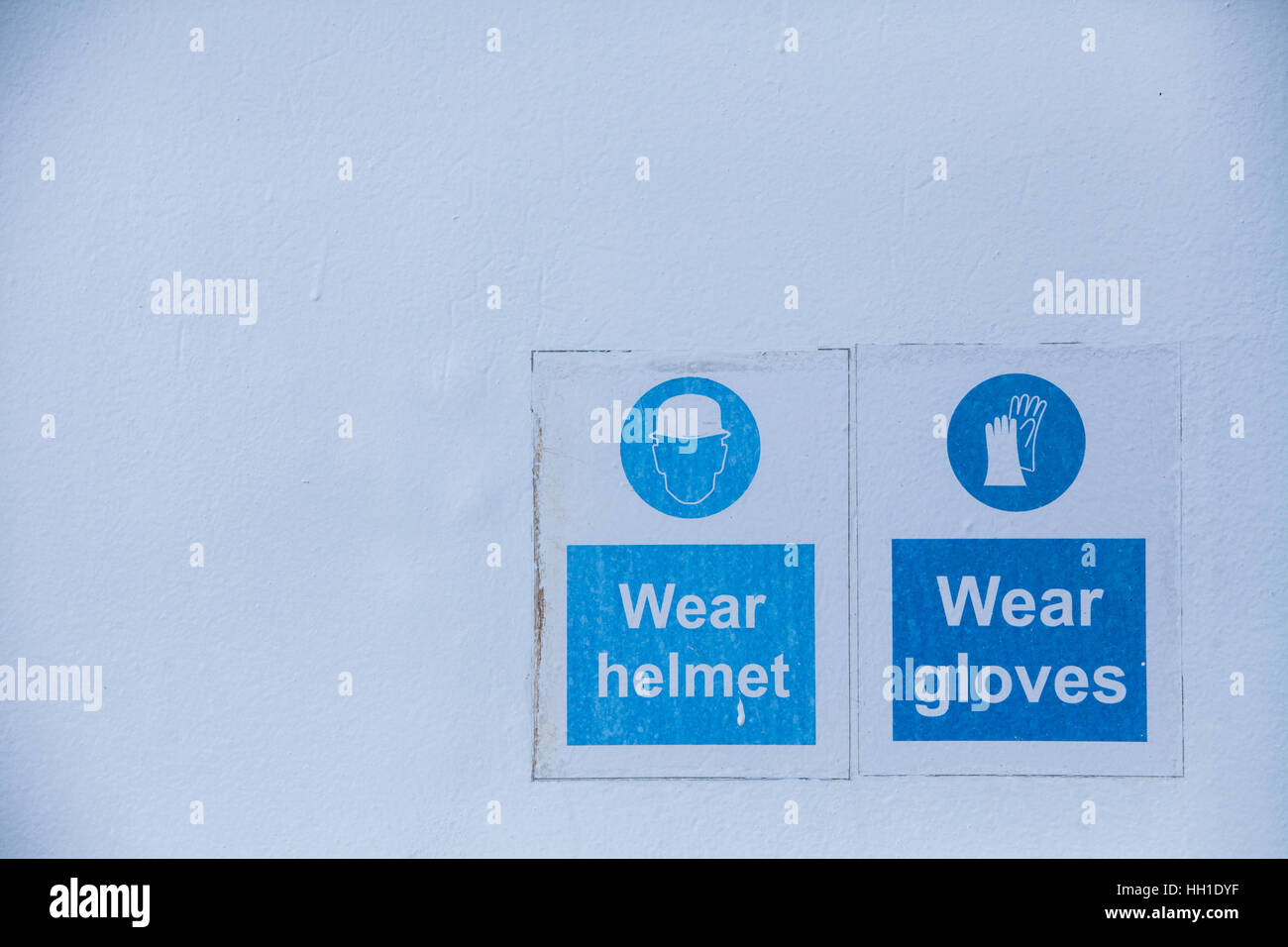 Close up shot of some signs with mandatory helmet and gloves Stock ...
