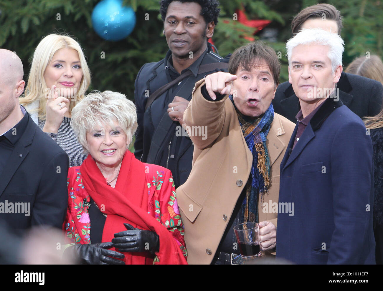 Cliff Richard singing on the south bank. Holly Willoughby, Philip ...