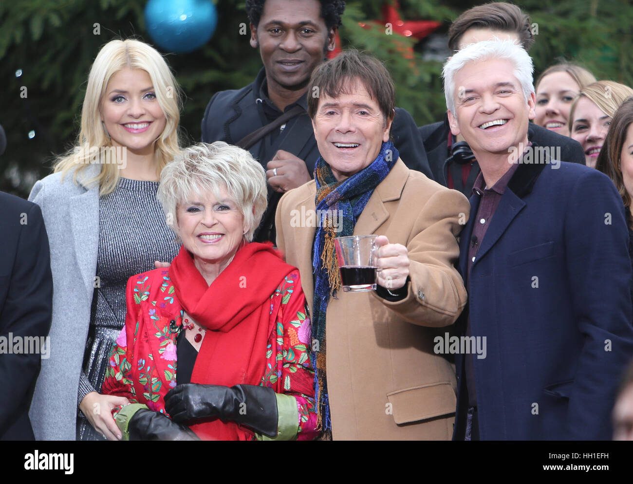 Cliff Richard singing on the south bank. Holly Willoughby, Philip ...
